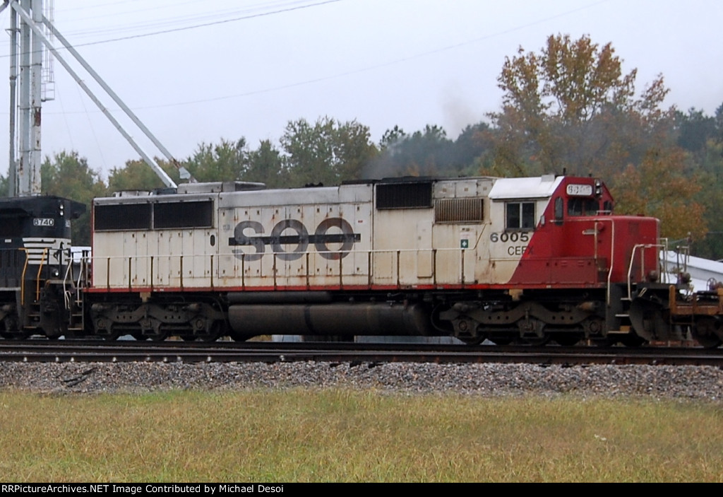 CEFX SD-60 #6005 (ex SOO) is second out on an eastbound that has just crossdd Main St.